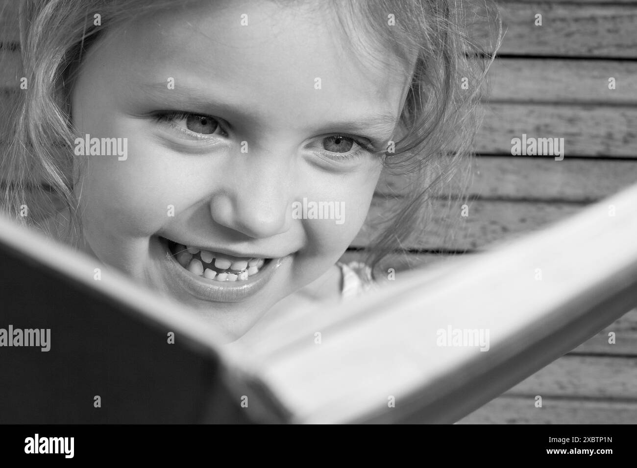 Beautiful young girl reading book Black and White Stock Photos & Images ...