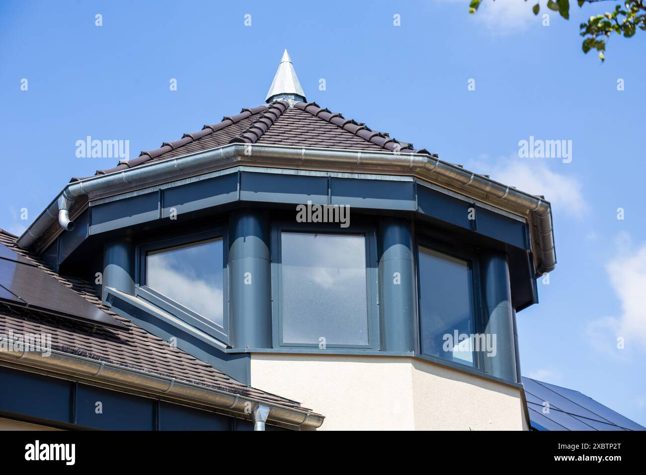 Strikingly beautiful roof construction with round dormer Stock Photo ...