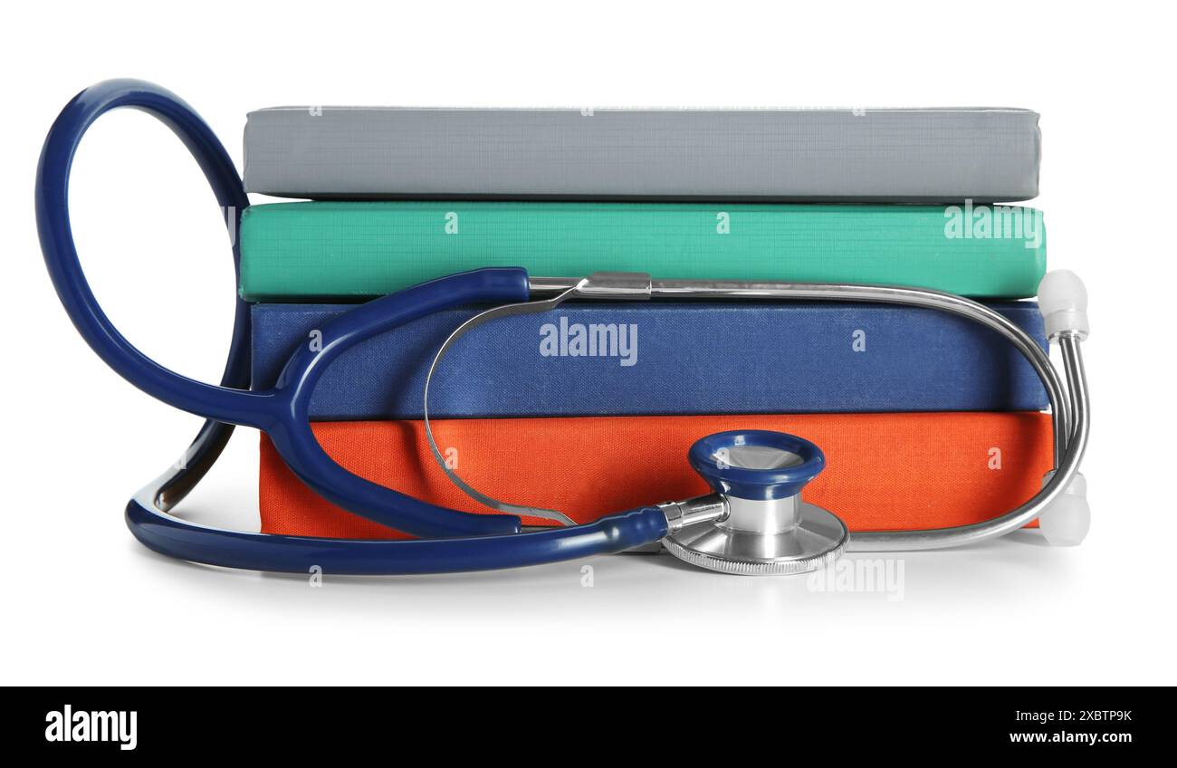 Stethoscope and stack of books isolated on white Stock Photo - Alamy