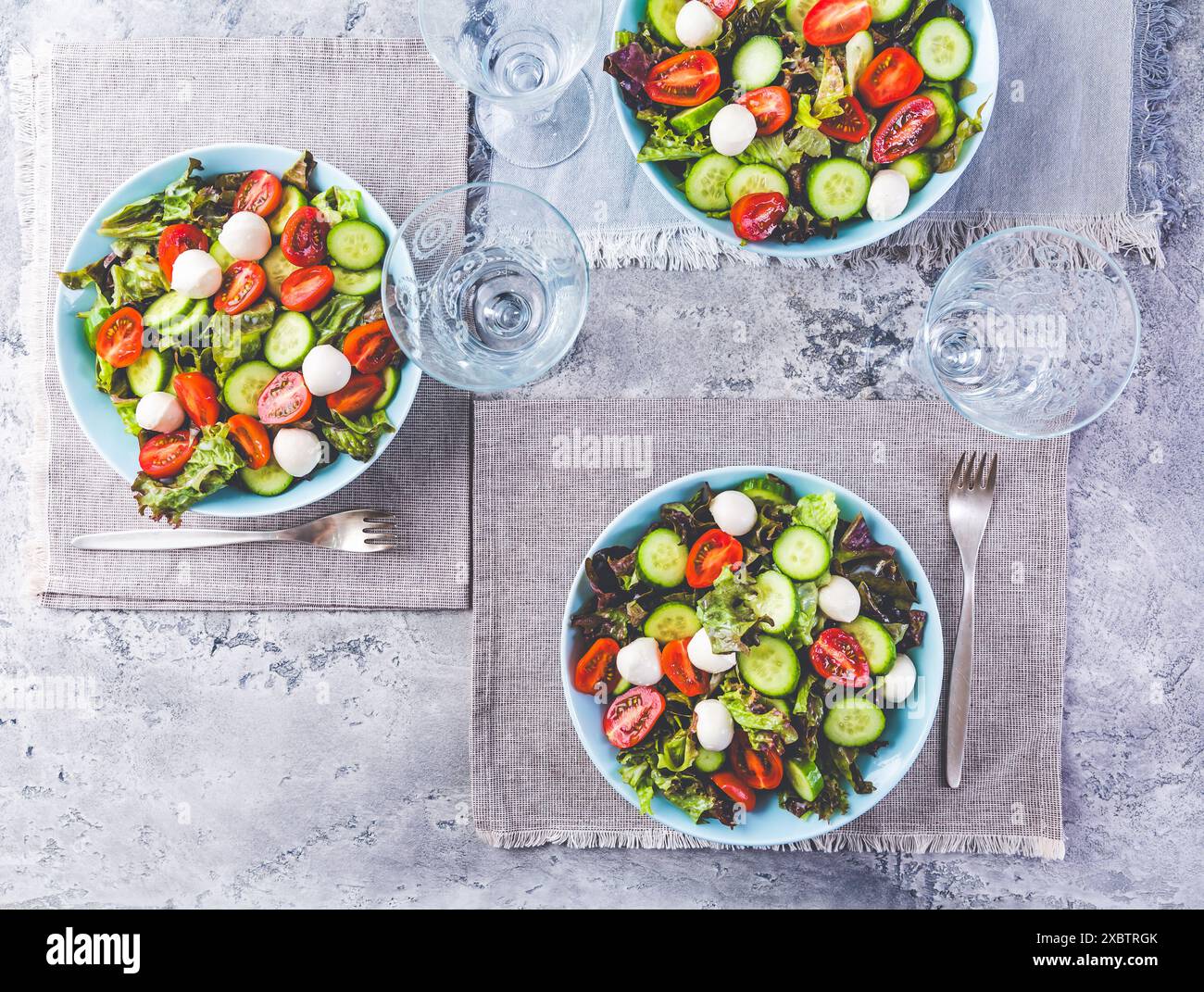 Dietary Italian salads with lettuce, tomatoes, mozzarella and cucumber ...
