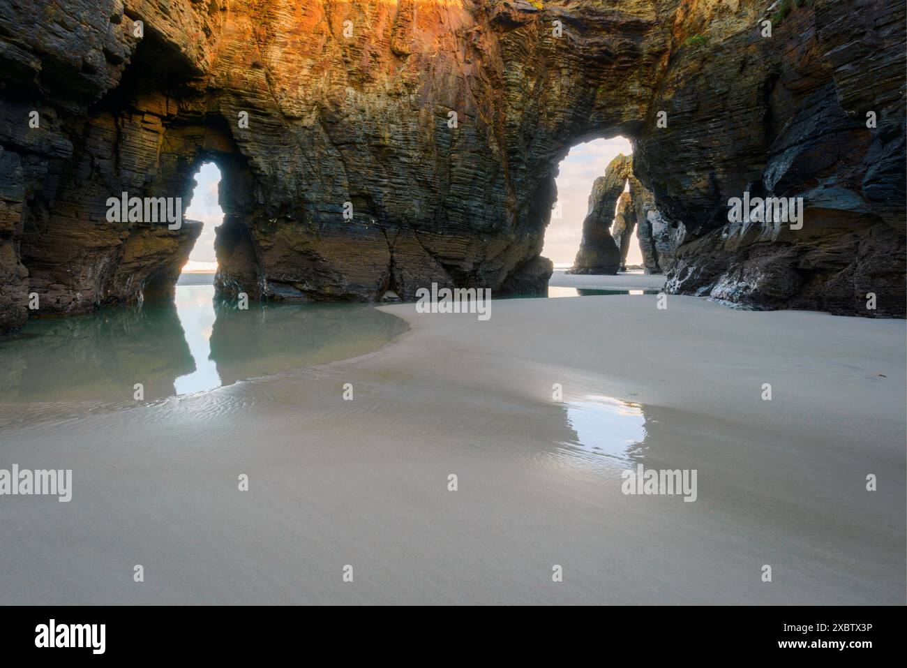 The iconic stone arches of the famous As Catedrais Beach in Ribadeo ...