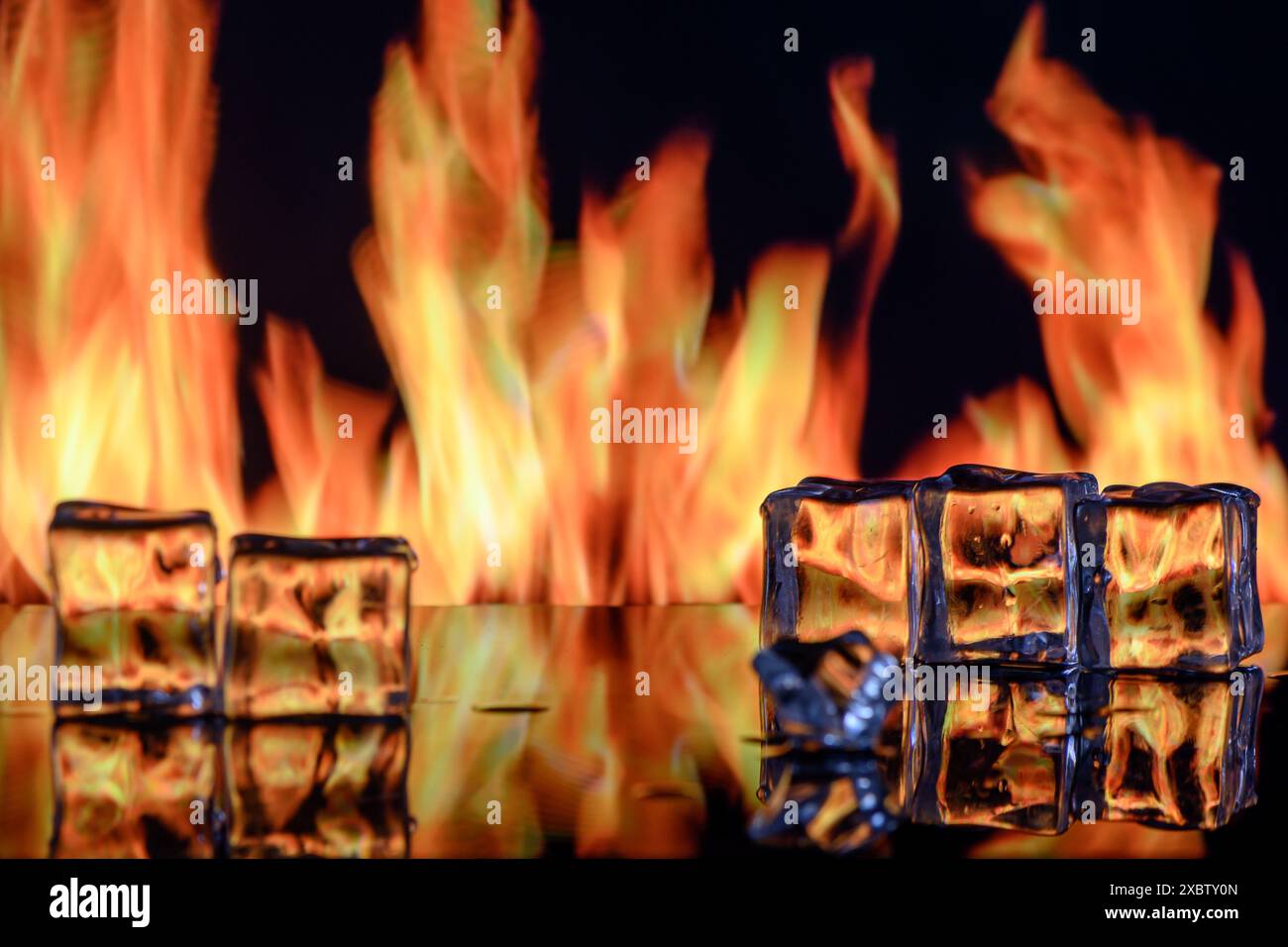 Burning ice cubes, fire and ice. 3 Stock Photo - Alamy
