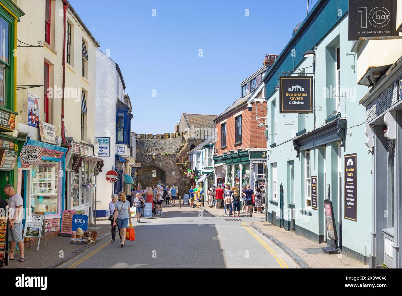 Tenby town centre Five Arches Tavern and people shopping on St Georges ...