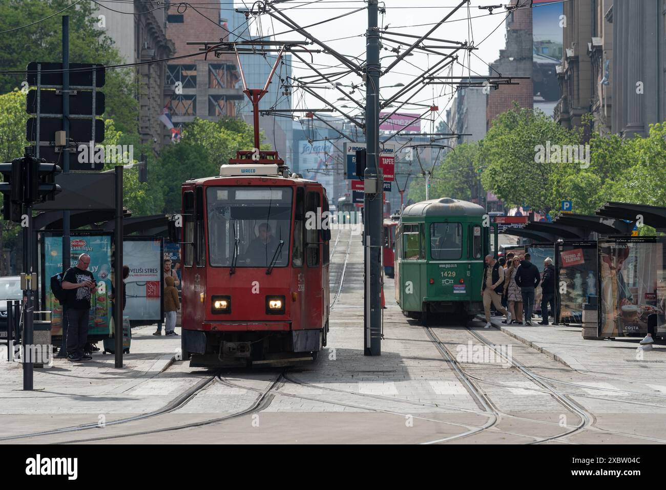 Traditional red and green electric trams on Nemanjina street in ...