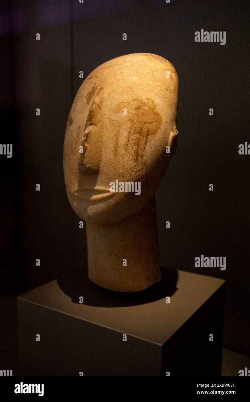 Statue of a face typical of the ancient art of the Cyclades archipelago ...
