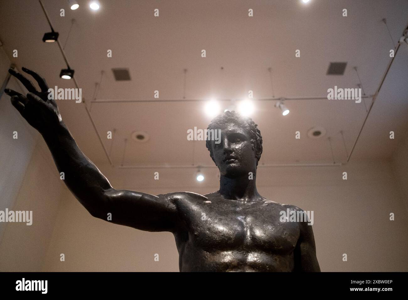 Antique bronze statue of the Ephebe of Antikythera, Paris, at the ...