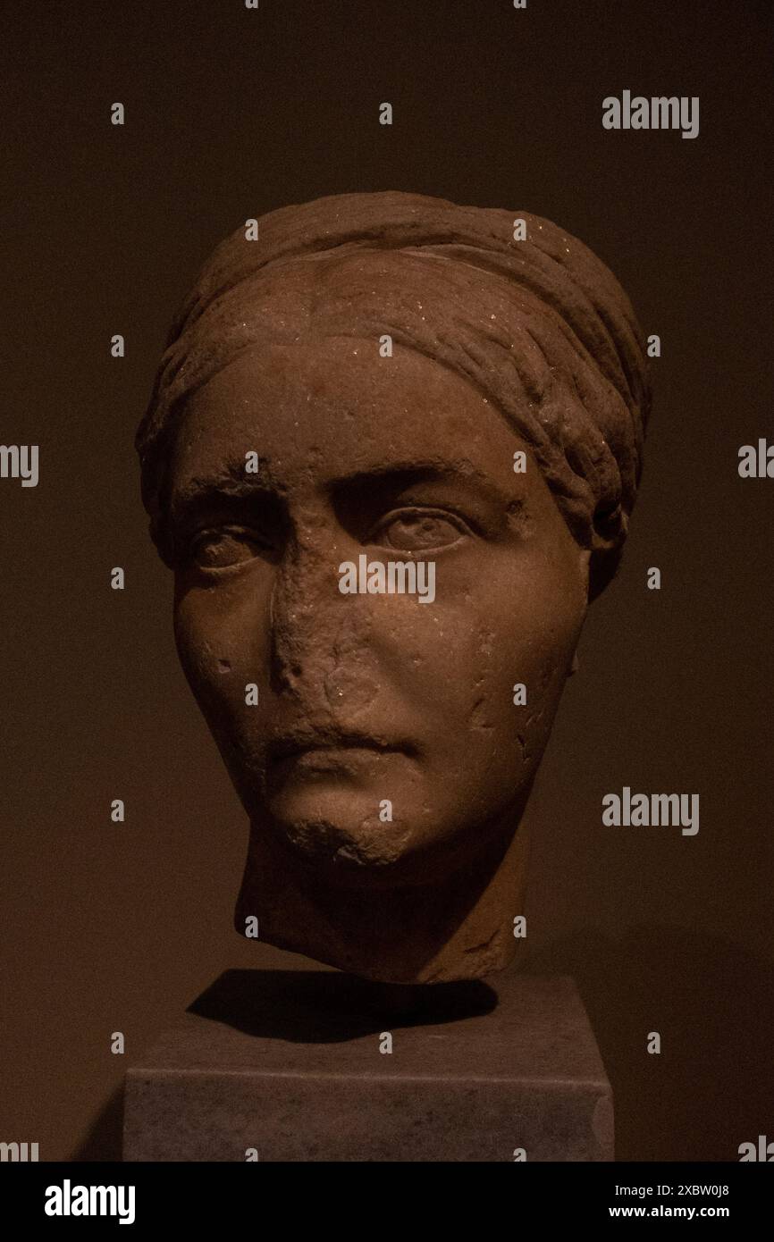 An ancient statue of a noseless woman's face in white marble at the ...