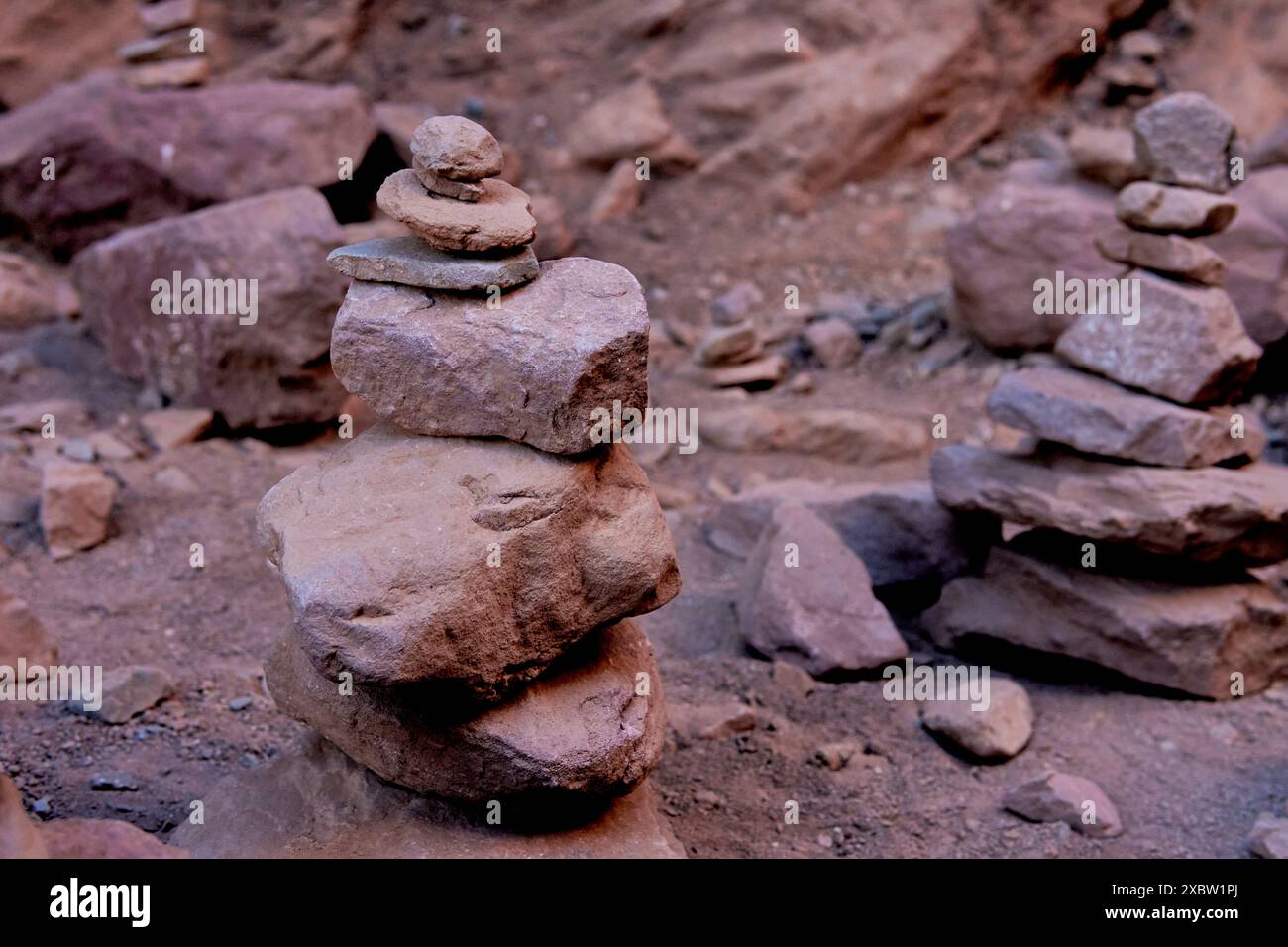 Stone cairn pyramid on a hike in the rocky mountains of cafayate ...