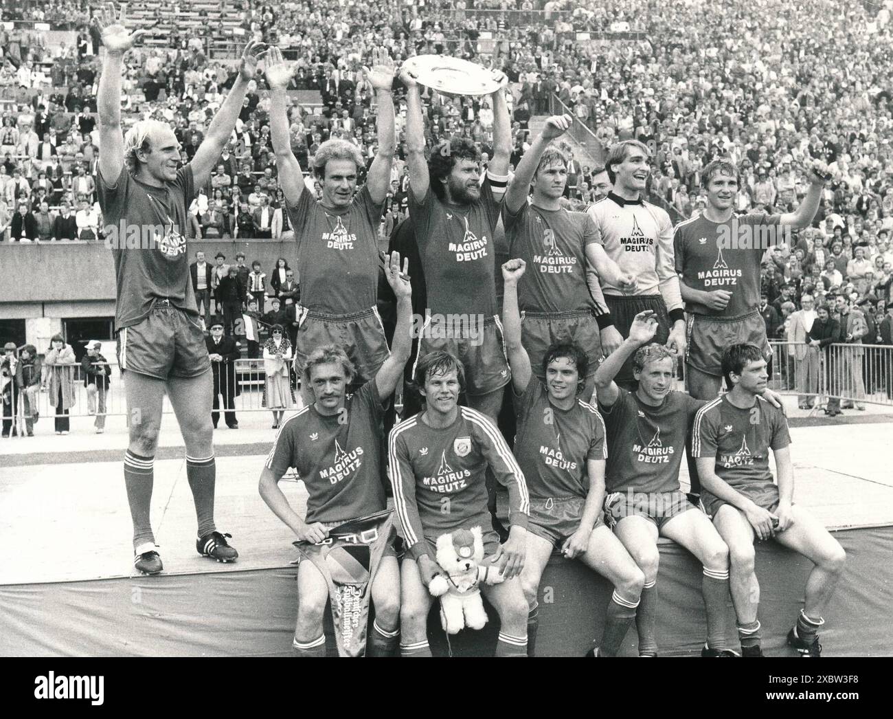 German soccer team of Bayern Munich pose with the trophy of German ...