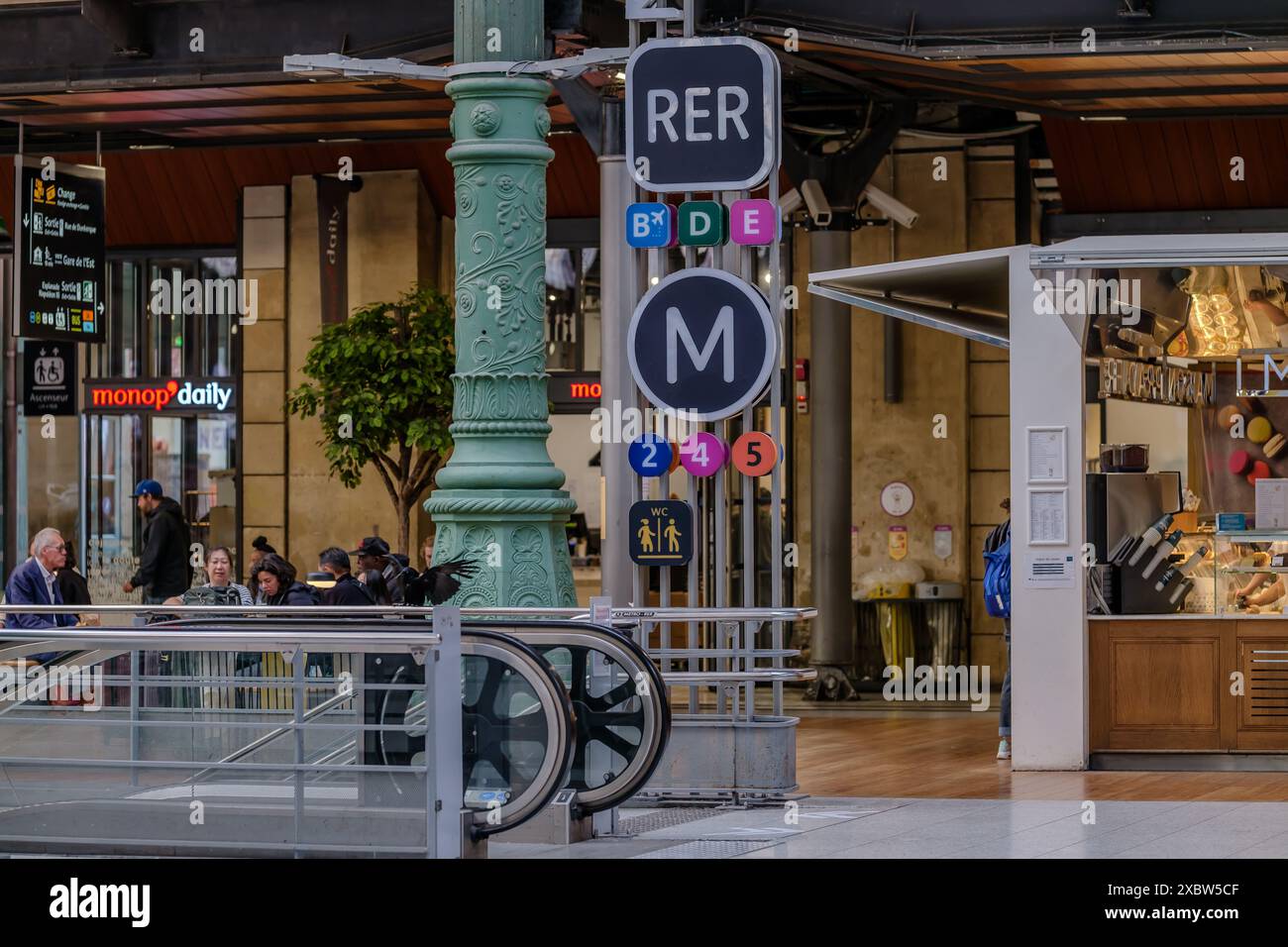 Paris, France - May 17, 2024 : View of signs leading to the metro ...