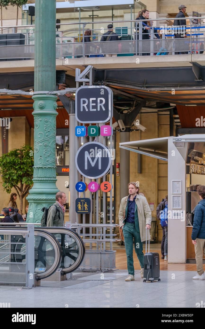 Paris, France - May 17, 2024 : View of signs leading to the metro ...