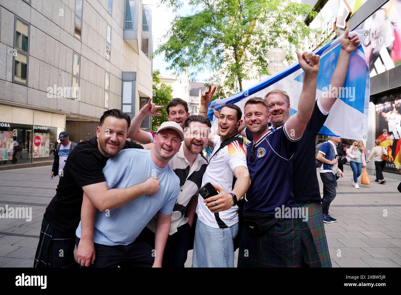 Scotland and Germany fans pose for a photo at Marienplatz, Munich ...