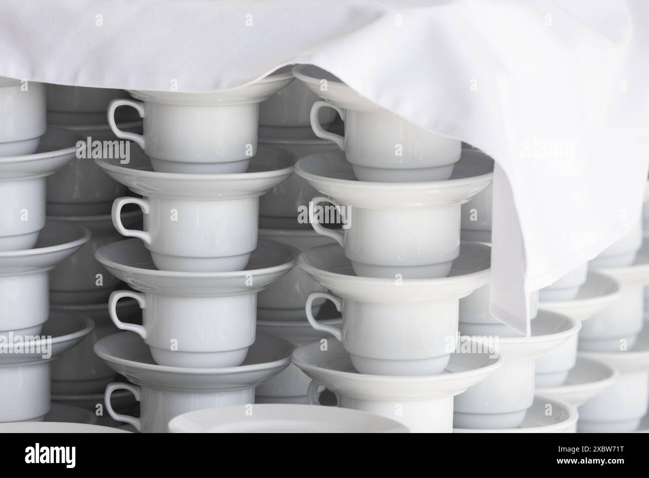 White cups and saucers on counter hi-res stock photography and images ...