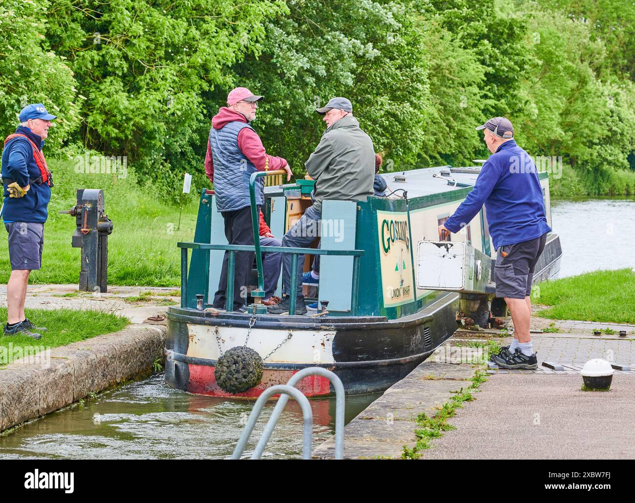 A canal boat leaves the top lock at the longest, steepest flight of ...