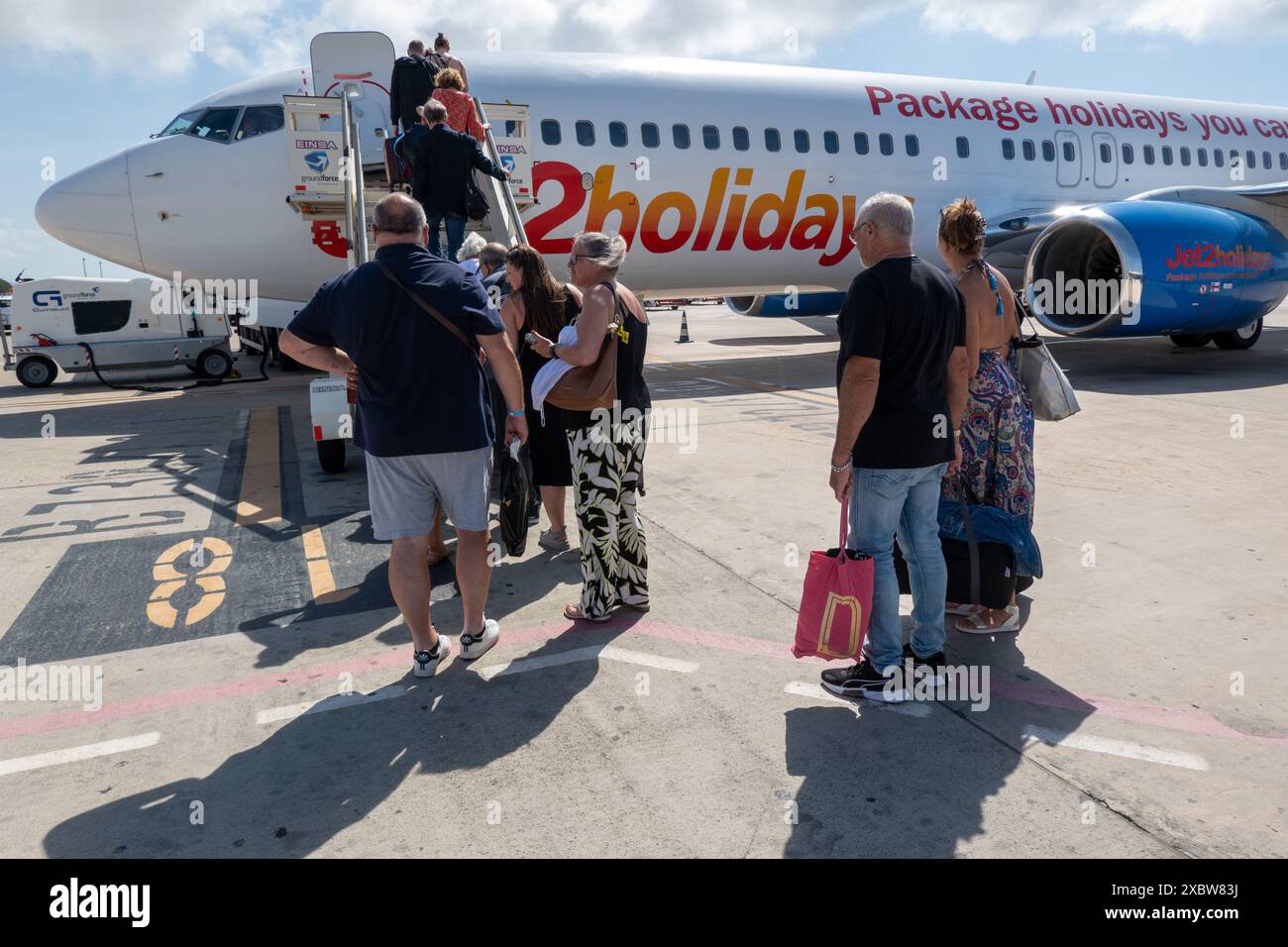 Picture dated May 2024 shows passengers boarding a Jet2 plane at Ibiza ...