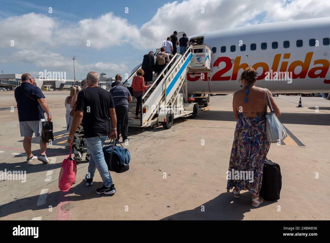 Picture dated May 2024 shows passengers boarding a Jet2 plane at Ibiza ...