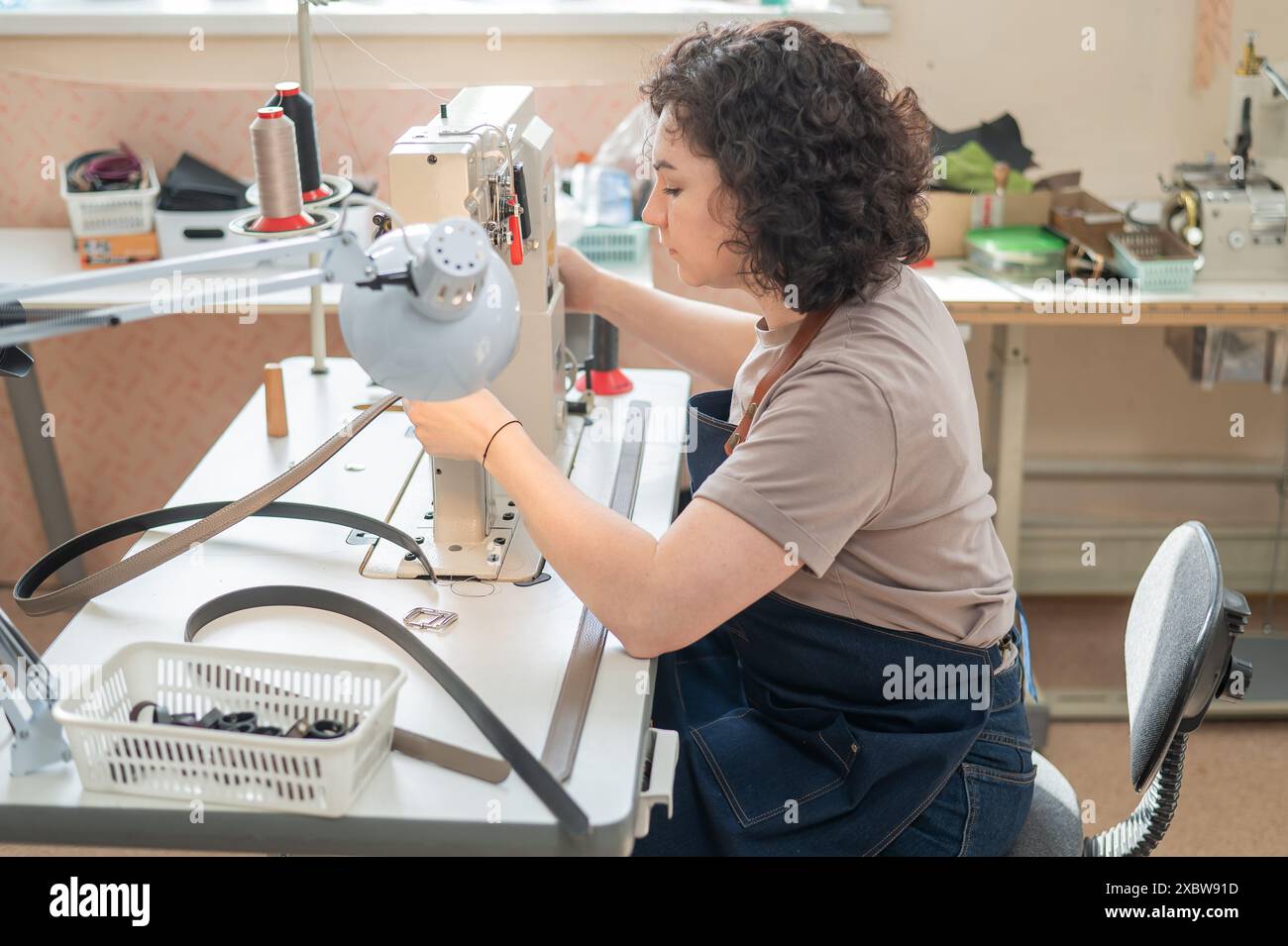 Woman tanner sews leather hi-res stock photography and images - Alamy