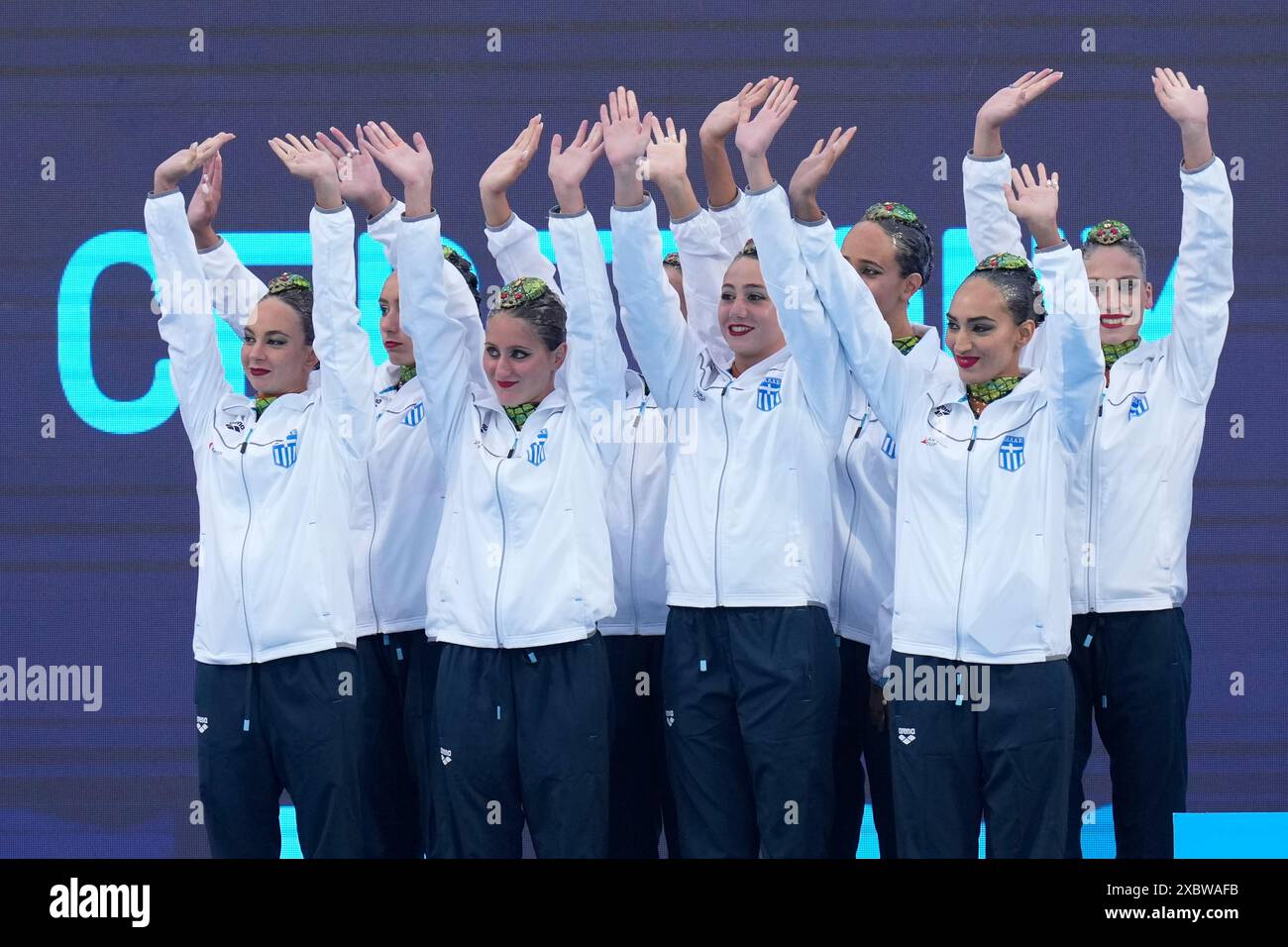 Members of team Greece celebrate their silver medal at the acrobatic ...