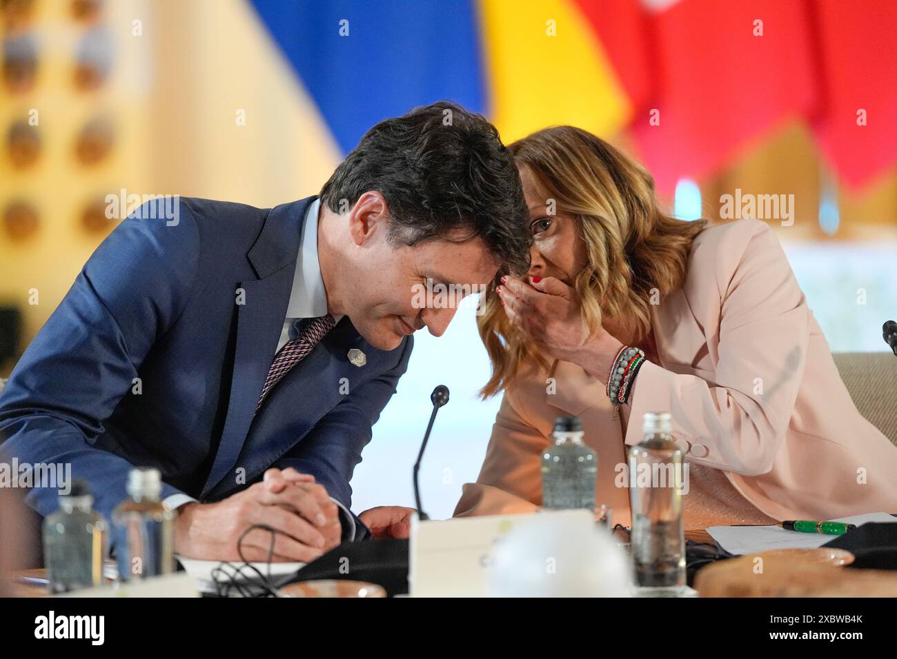 Italian Prime Minister Giorgia Meloni, right, talks to Canada's Prime ...
