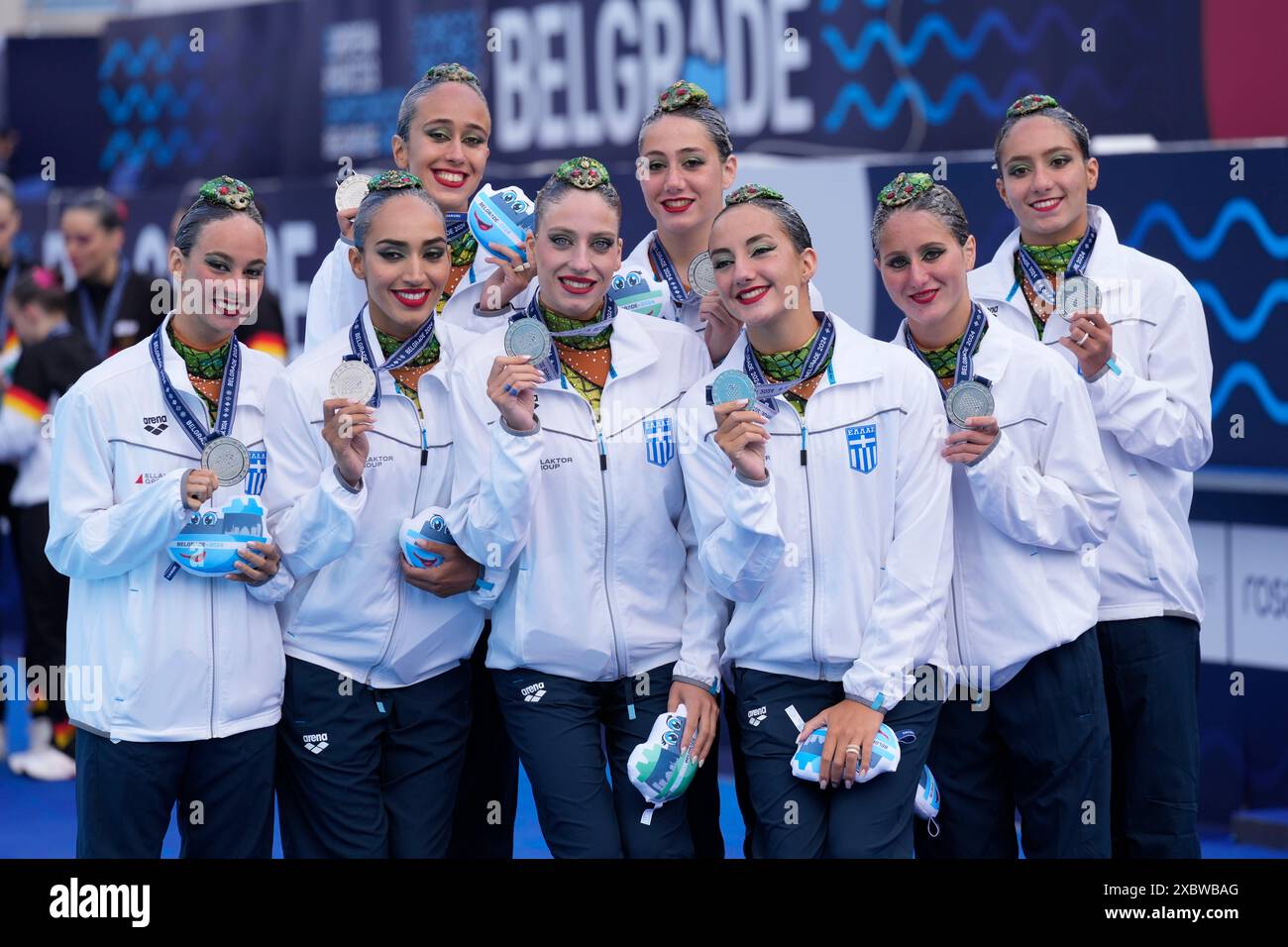 Members of team Greece celebrate their silver medal at the acrobatic ...