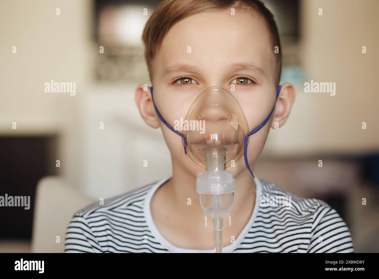 Sick teenager boy kid with cough doing inhalation at home with ...