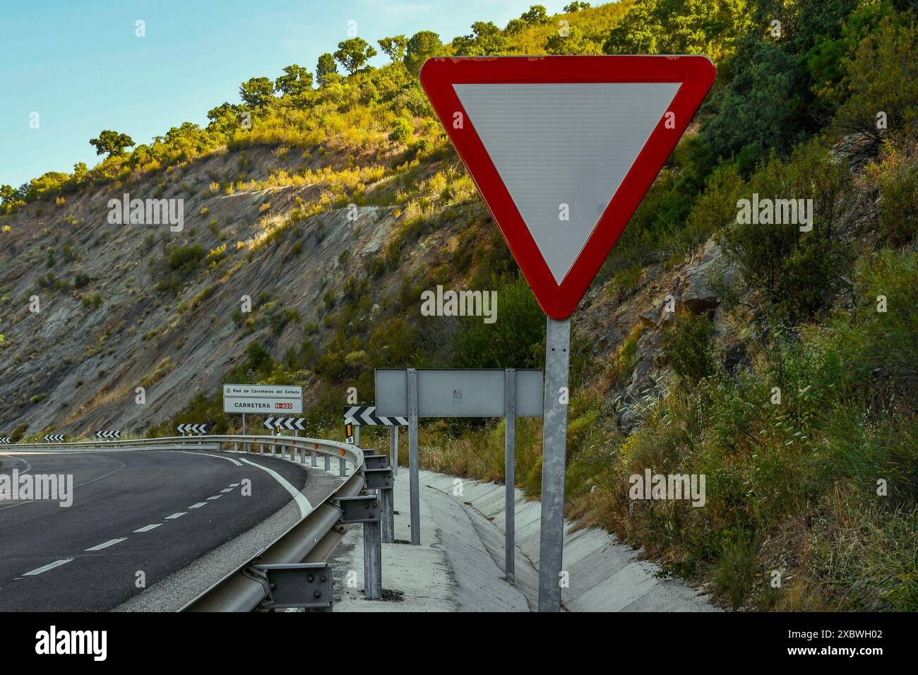Priority signs, the yield sign is an equilateral triangle in white with ...
