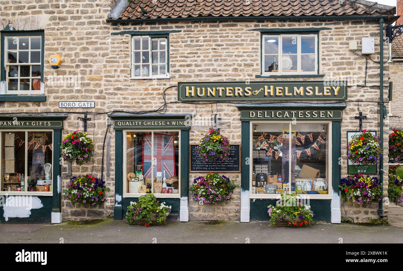 Hunters of Helmsley delicatessen exterior with hanging flower baskets ...