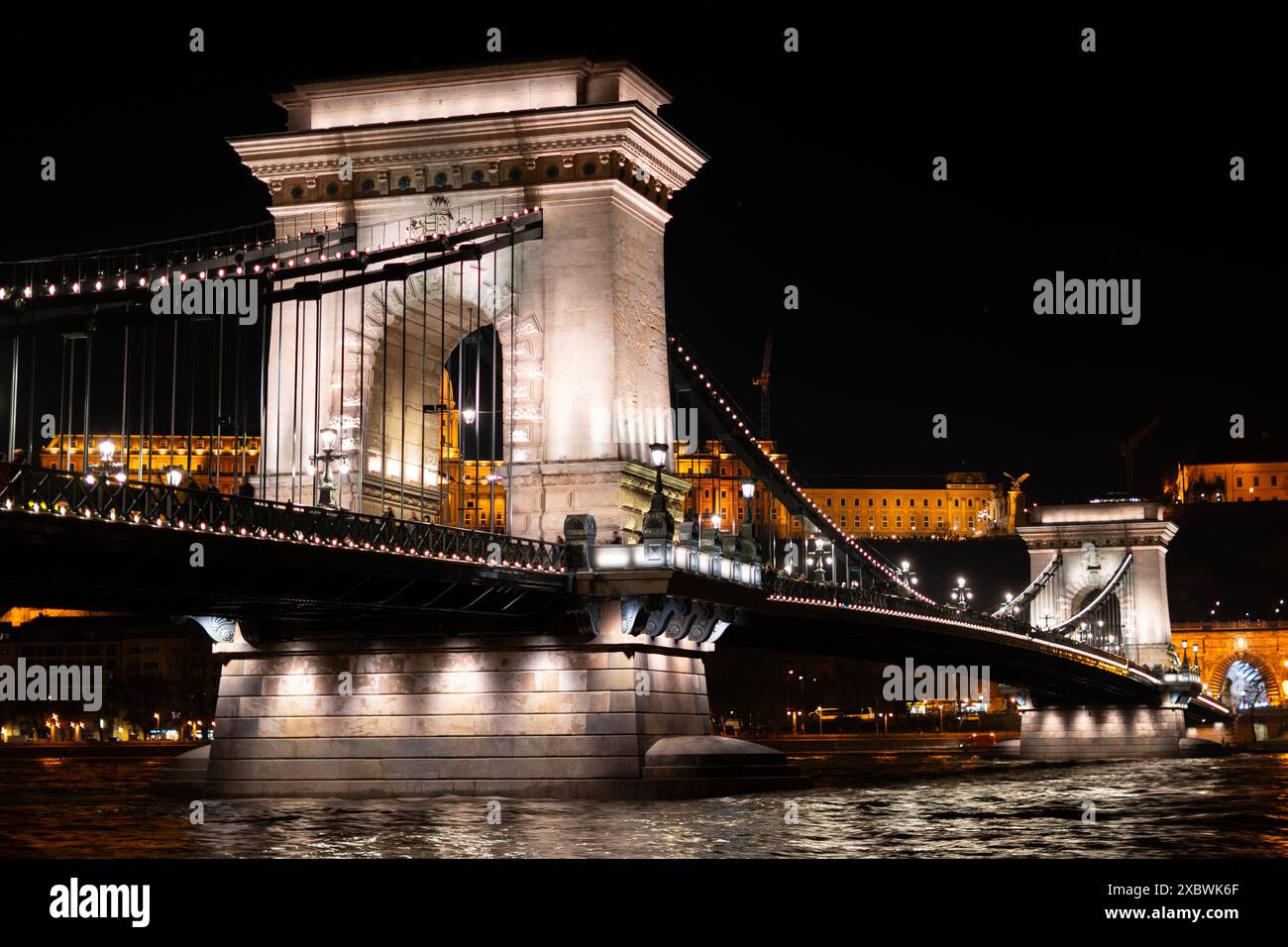The historic Chain Bridge illuminated at night in Budapest Stock Photo ...