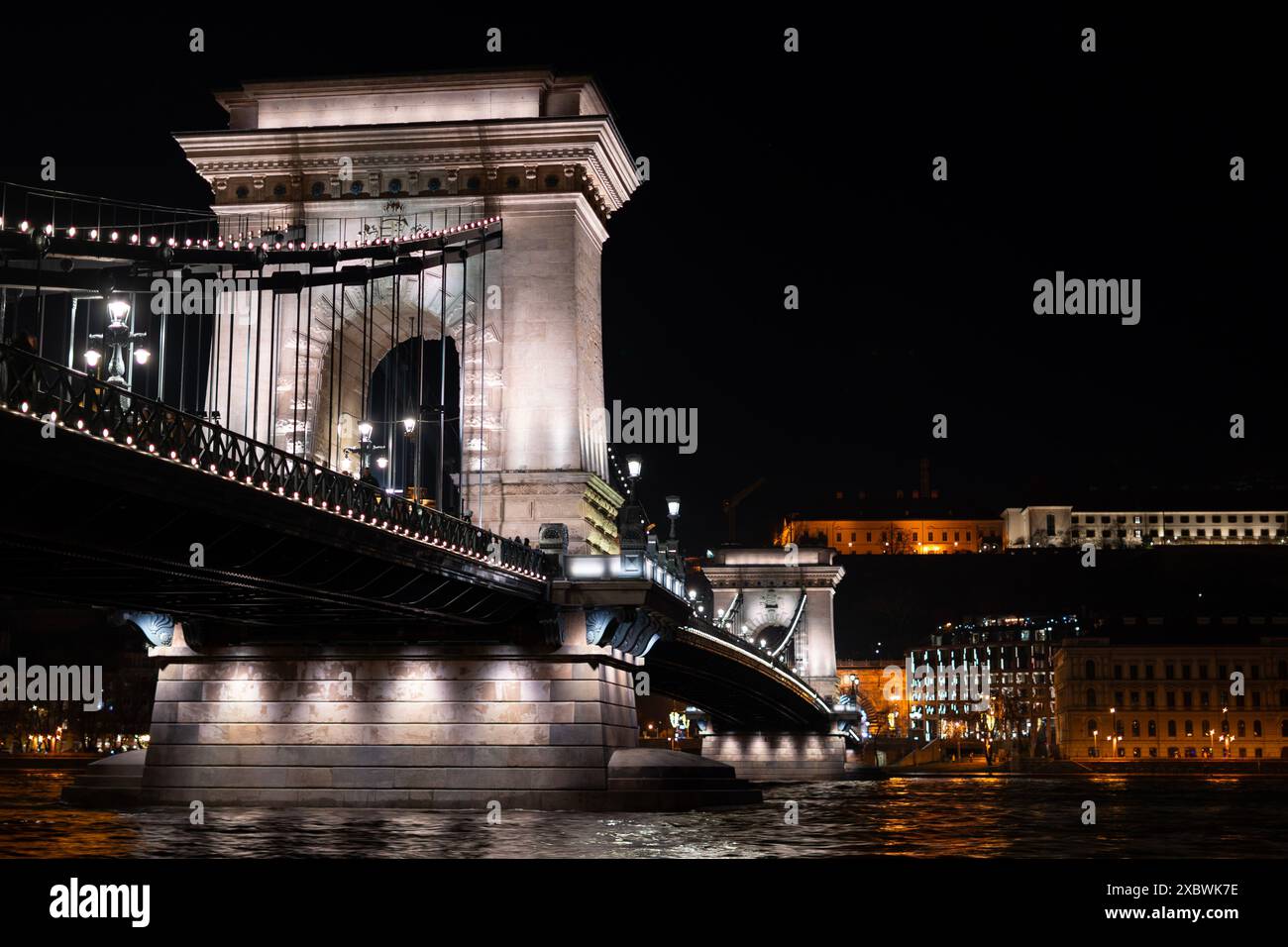 The historic Chain Bridge illuminated at night in Budapest Stock Photo ...