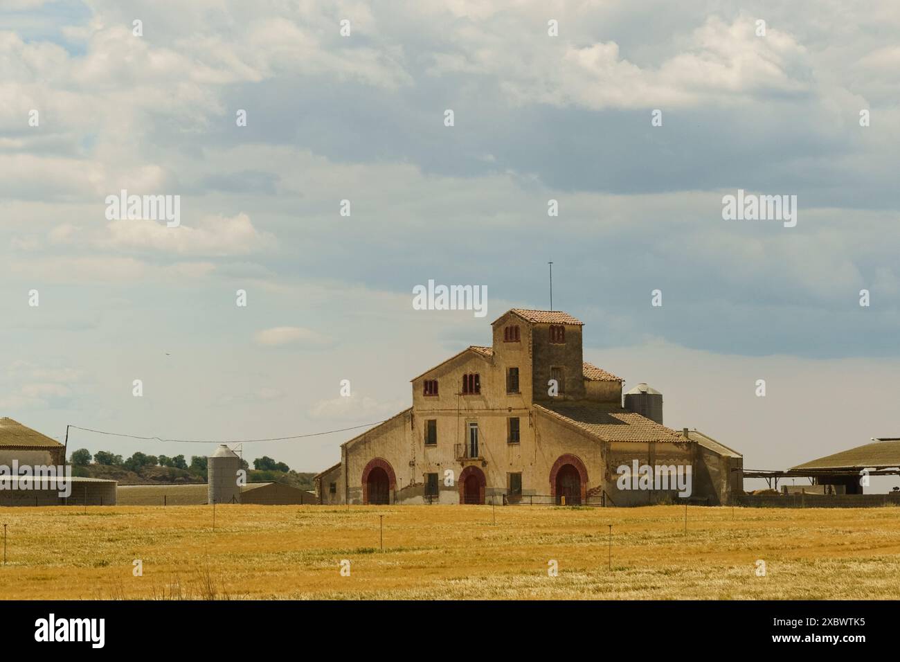 A large building standing prominently in the middle of an expansive ...