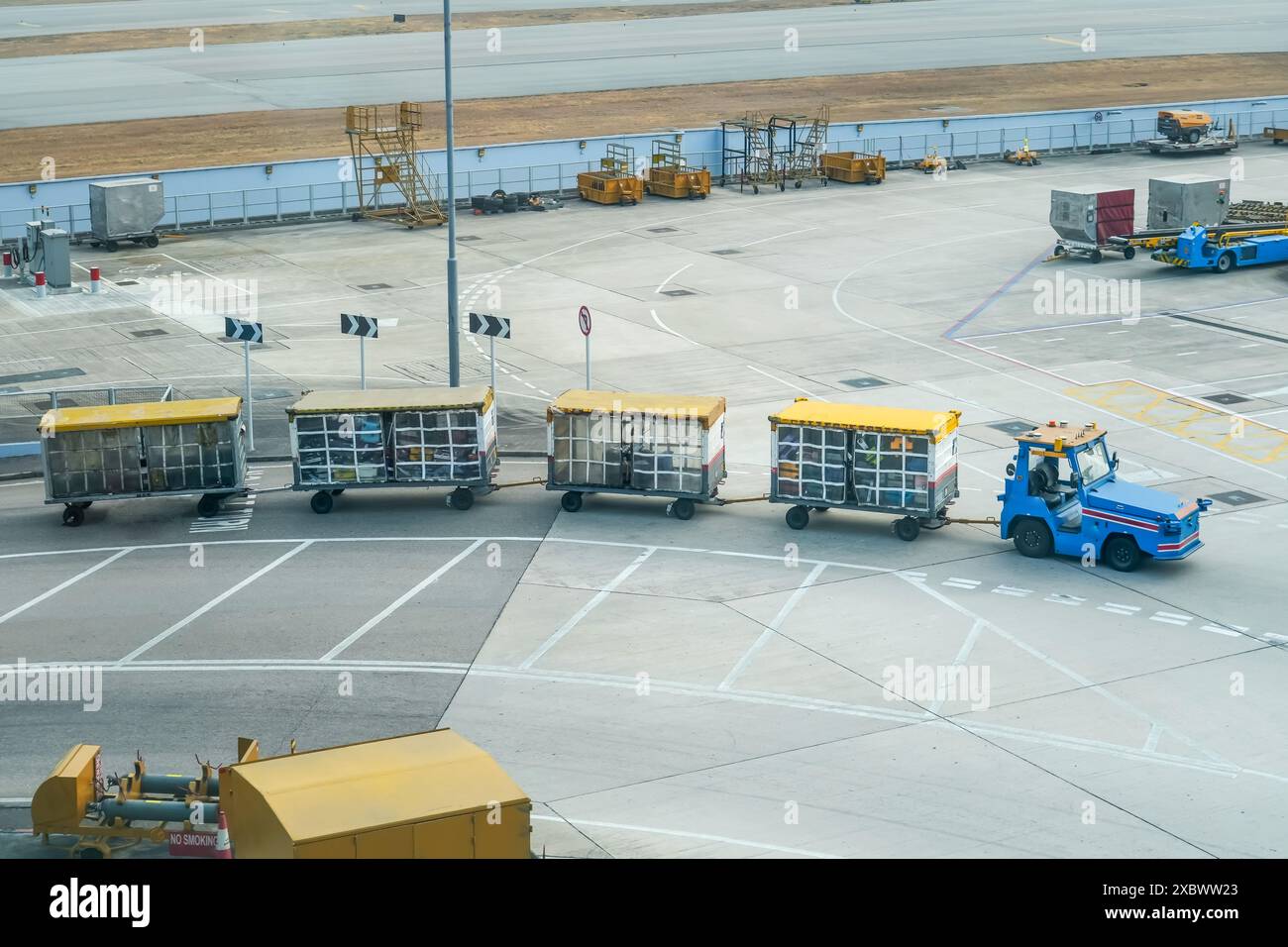 Baggage carts in the train carry passengers suitcases for loading onto ...