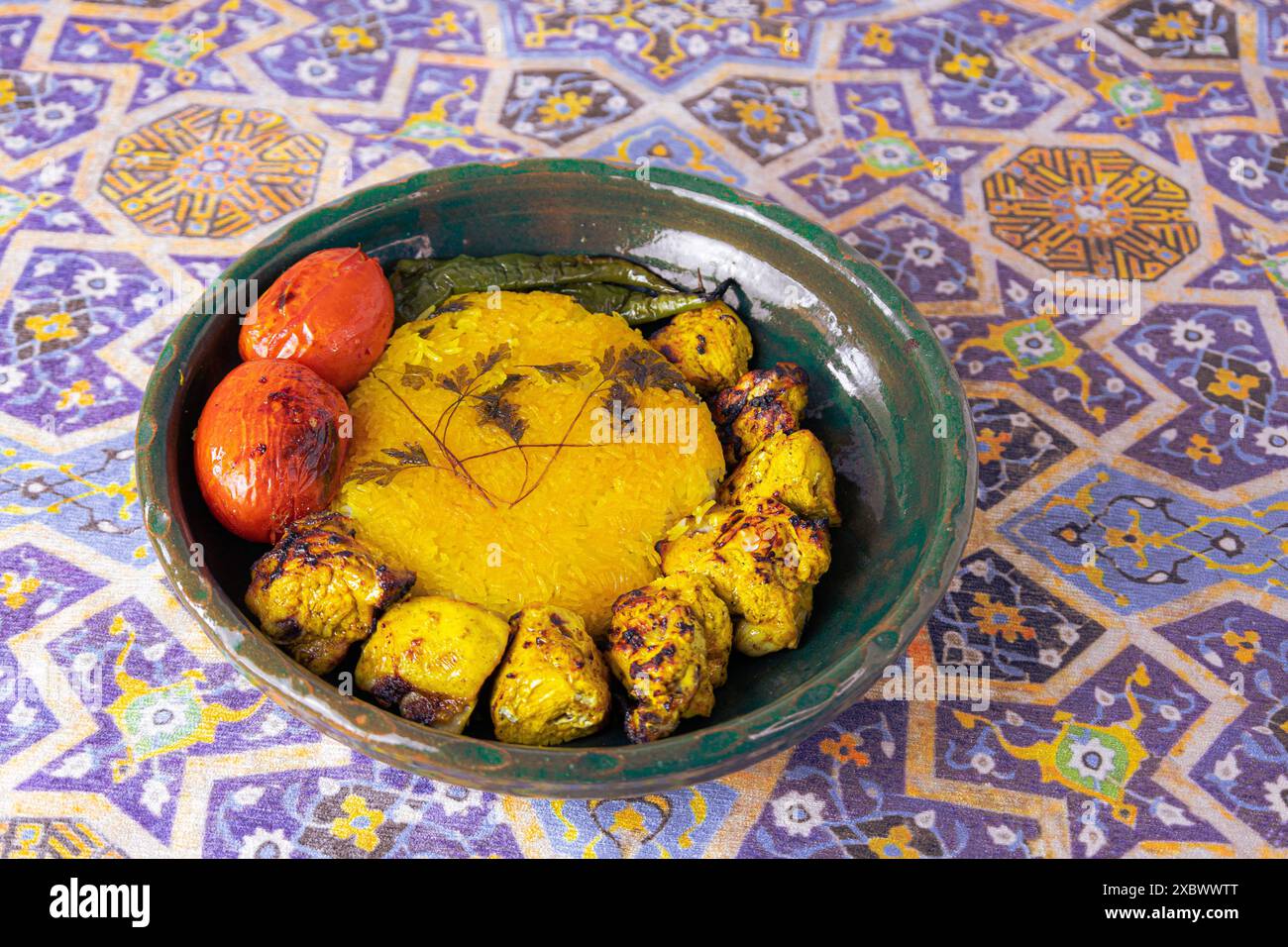 Persian style chicken kebab with saffron rice, grilled chilies and ...