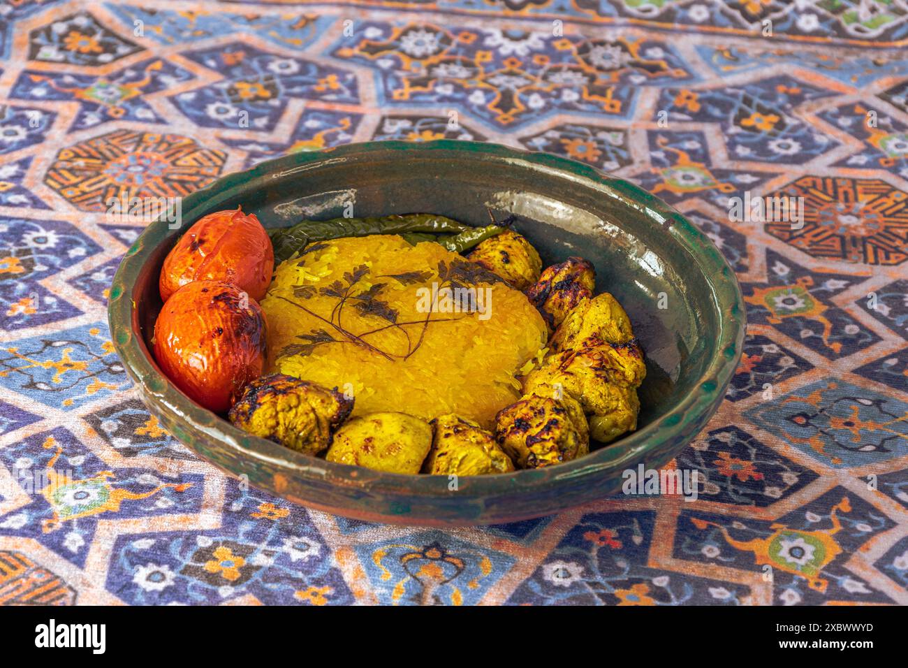 Persian style chicken kebab with saffron rice, grilled chilies and ...