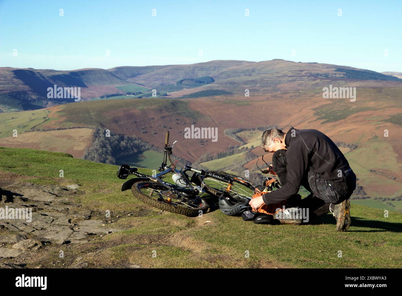 Mountain biker on Sugar Loaf, Mynydd Pen-y-fal, on the southern edge of ...