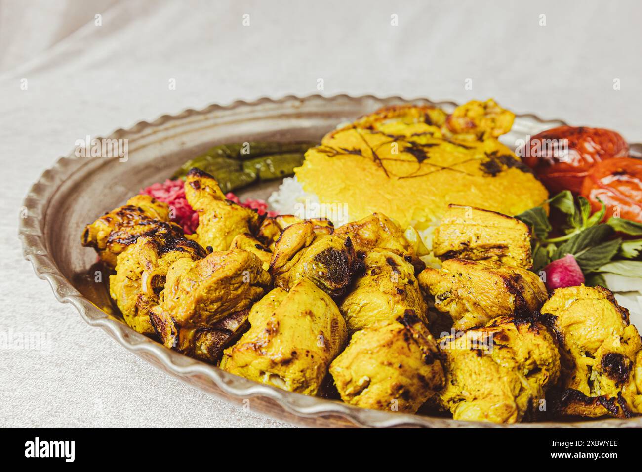 Middle eastern chicken kebab with saffron rice and vegetables on a ...