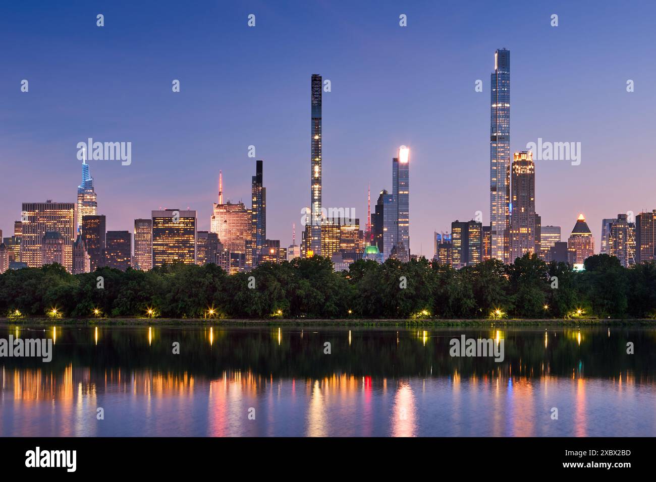 New York City skyline at dusk with Billionaires Row supertall skyscrapers from Central Park ...