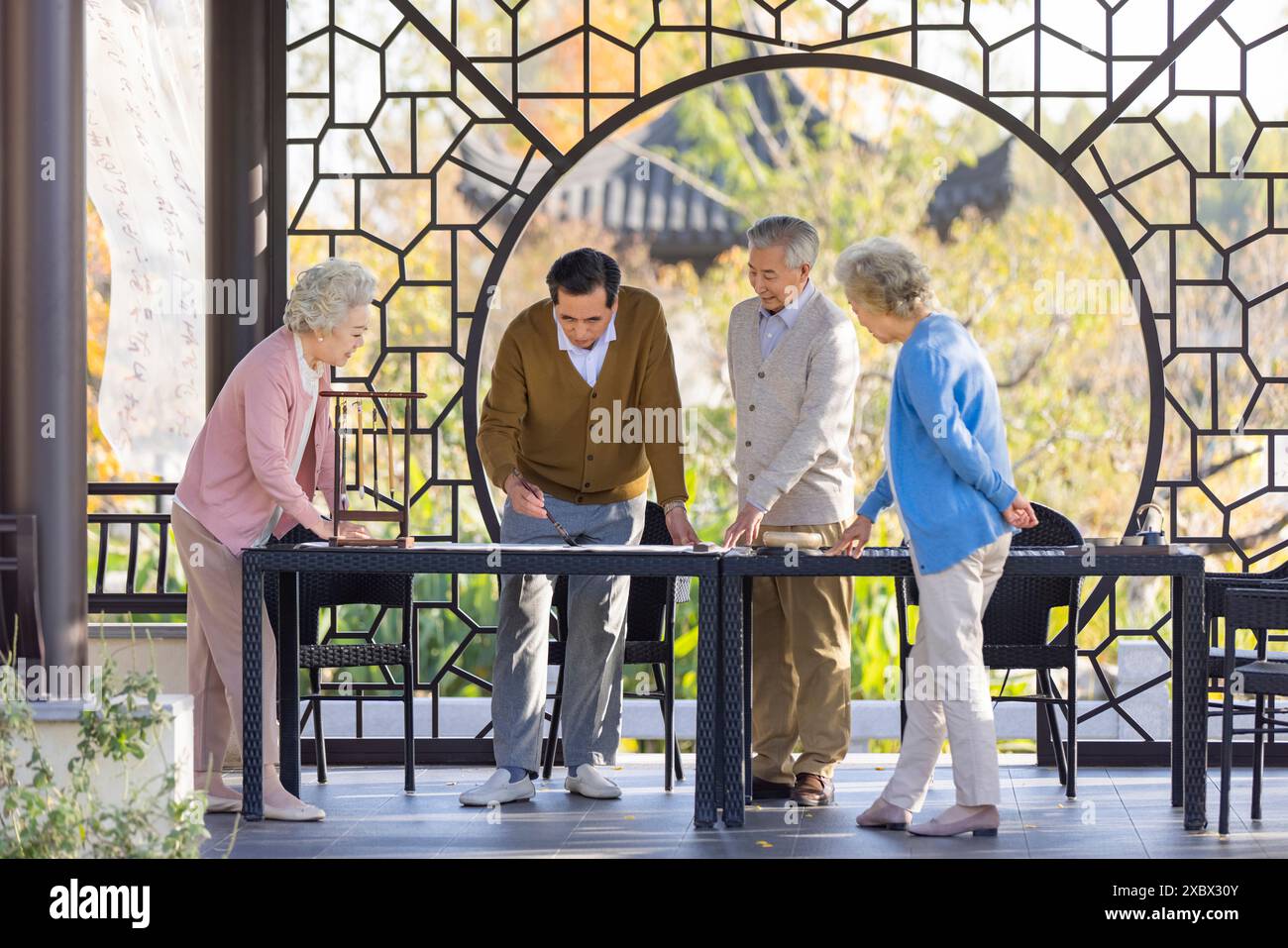Senior Friends Practicing Chinese Calligraphy Stock Photo - Alamy