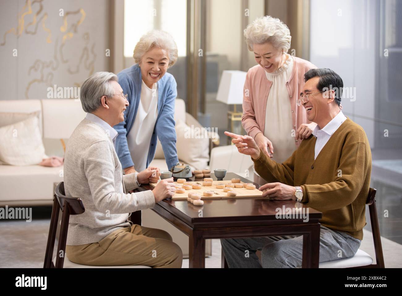 Laughing and playing chess hi-res stock photography and images - Alamy