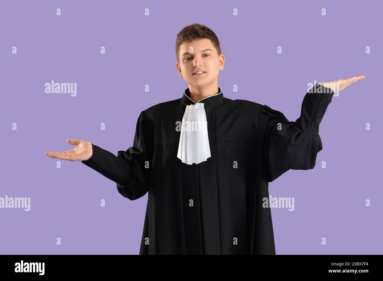 Teenage judge on lilac background Stock Photo - Alamy
