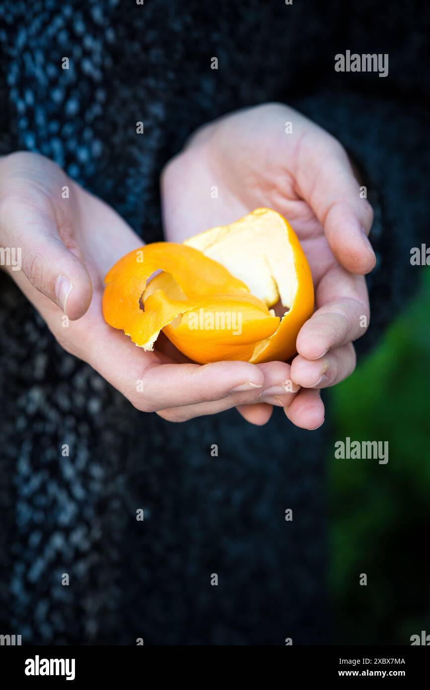 Female hands hold two peeled hi-res stock photography and images - Alamy