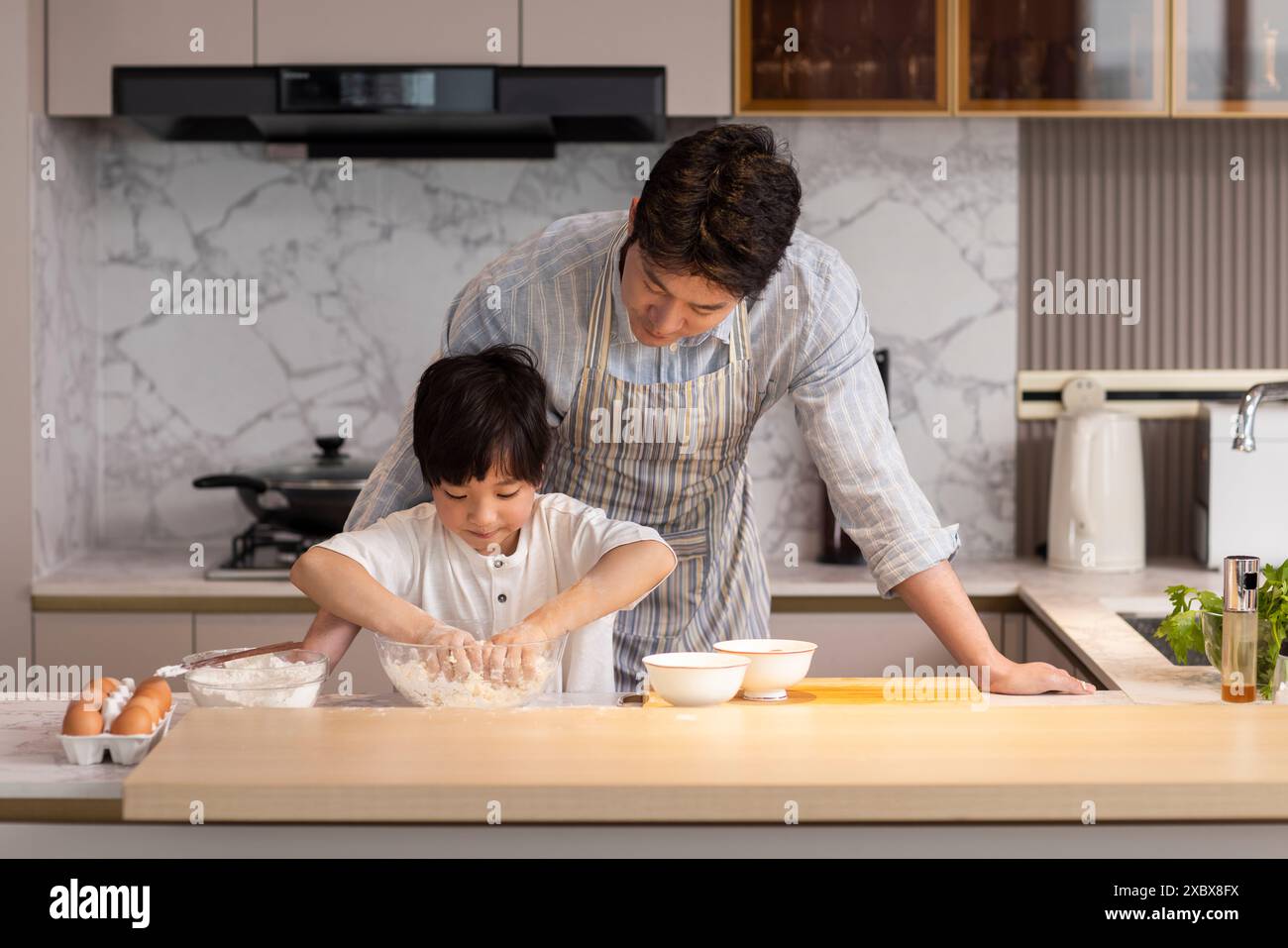 Father And Son Cooking In The Kitchen Stock Photo - Alamy