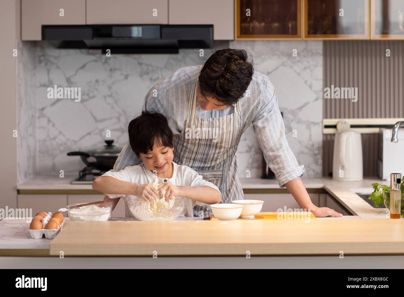 Father And Son Cooking In The Kitchen Stock Photo - Alamy