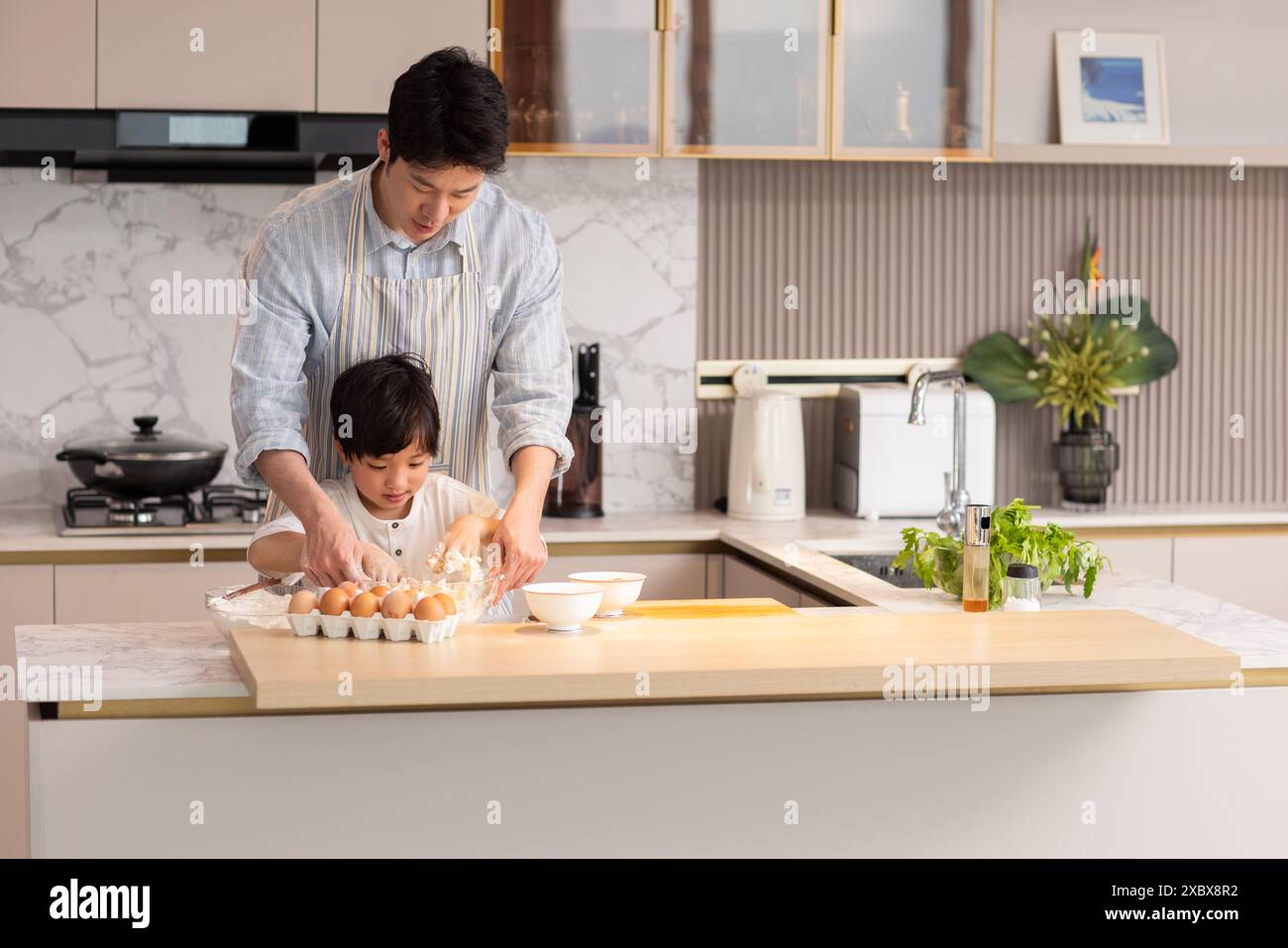 Father And Son Cooking In The Kitchen Stock Photo - Alamy
