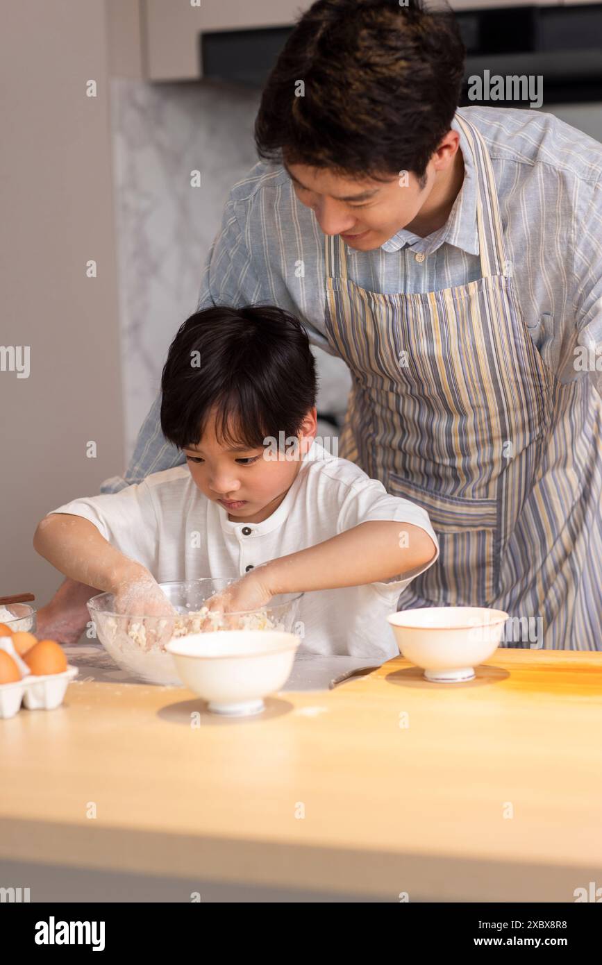 Father And Son Cooking In The Kitchen Stock Photo - Alamy