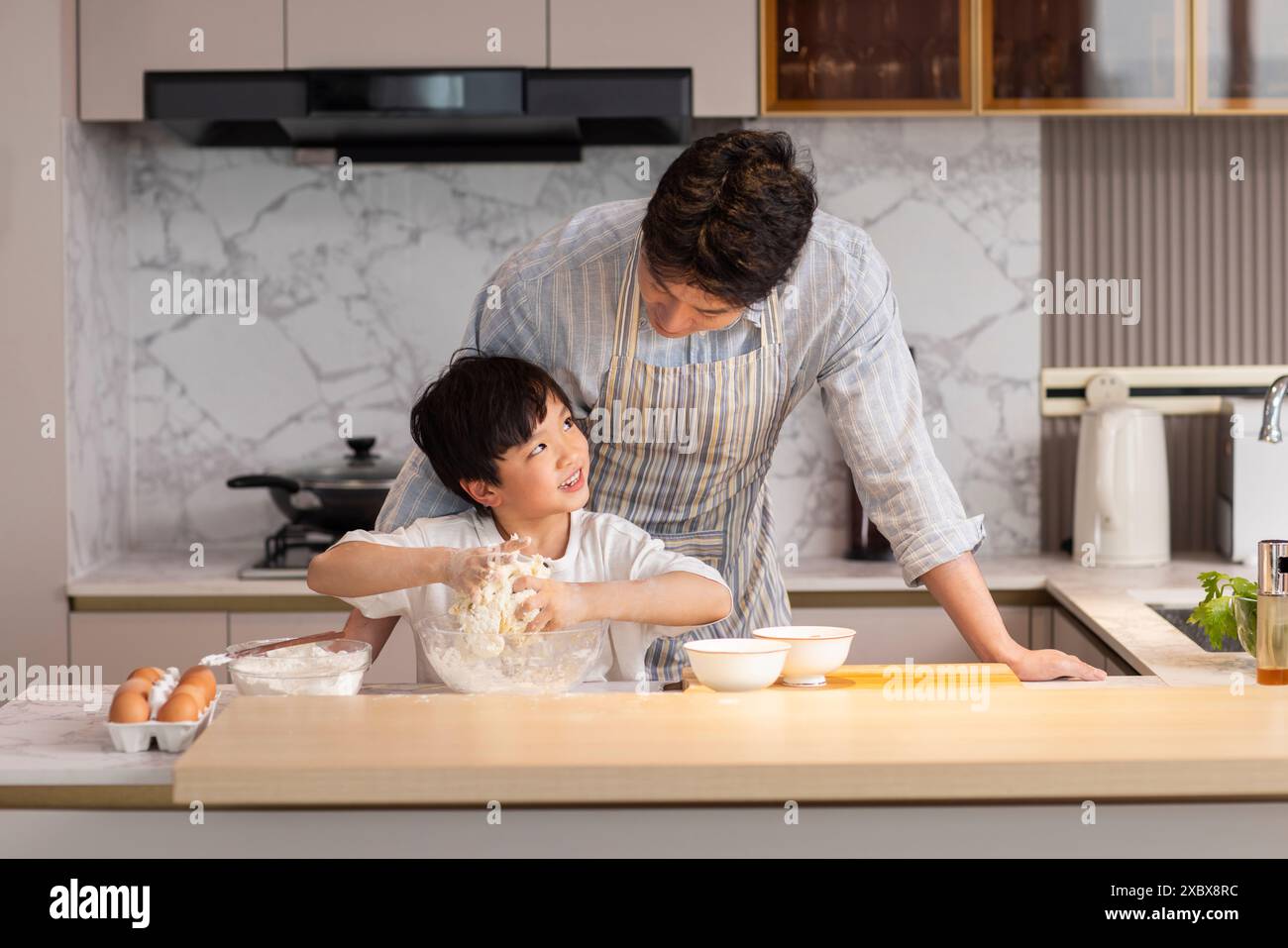 Father And Son Cooking In The Kitchen Stock Photo - Alamy