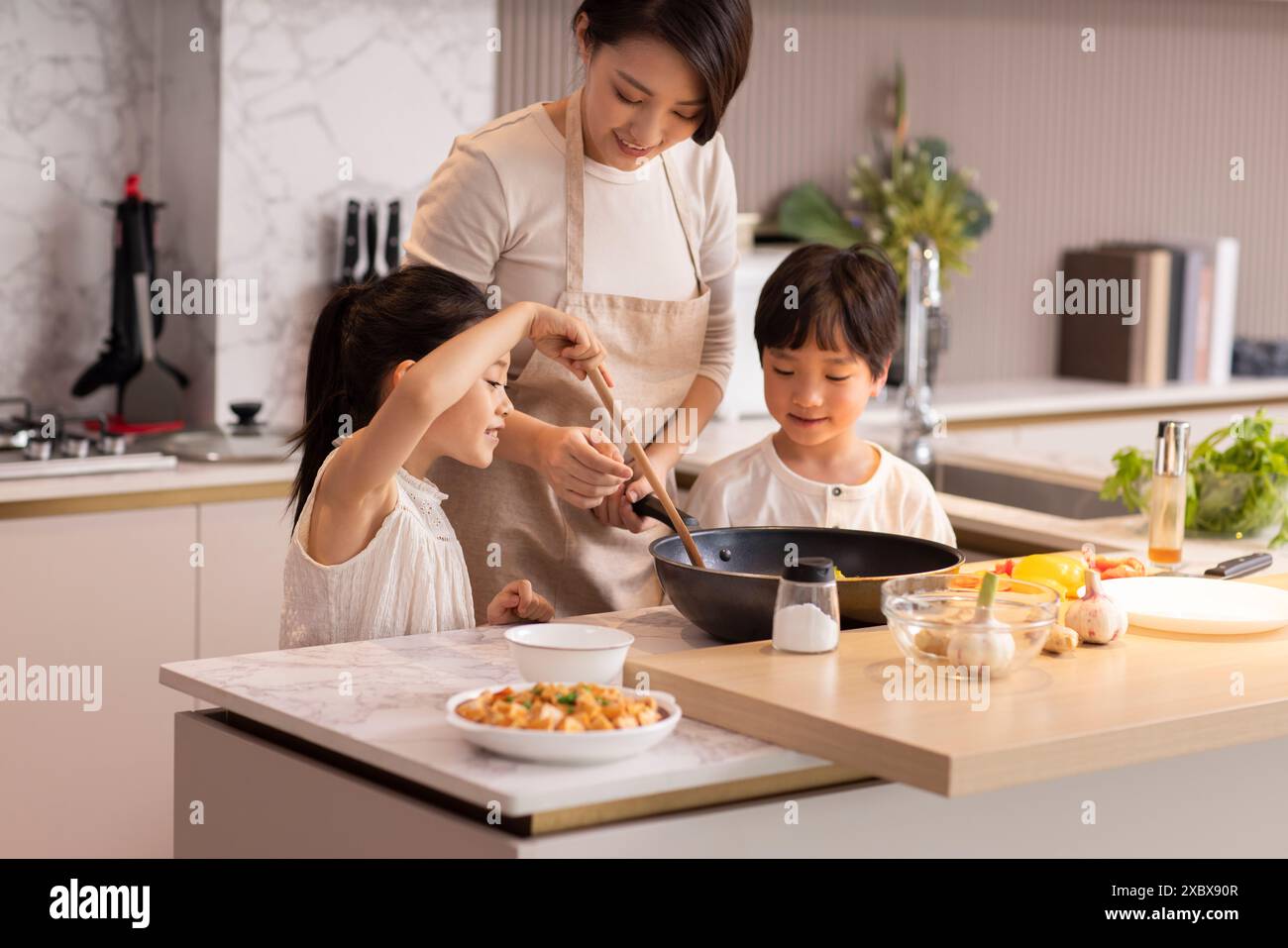 Indian mother and daughter cooking hi-res stock photography and images ...