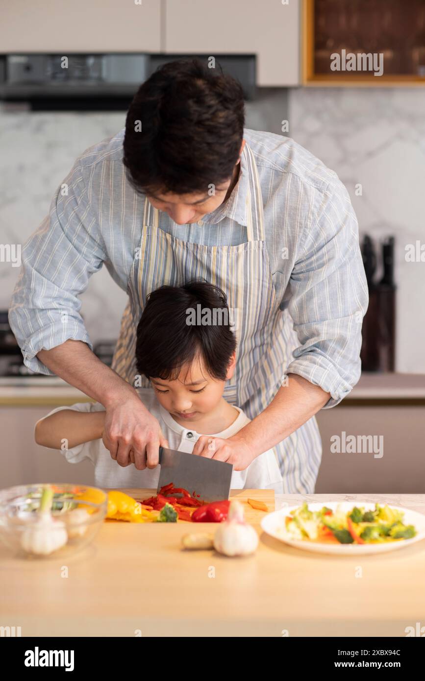 Father And Son Cooking In The Kitchen Stock Photo - Alamy