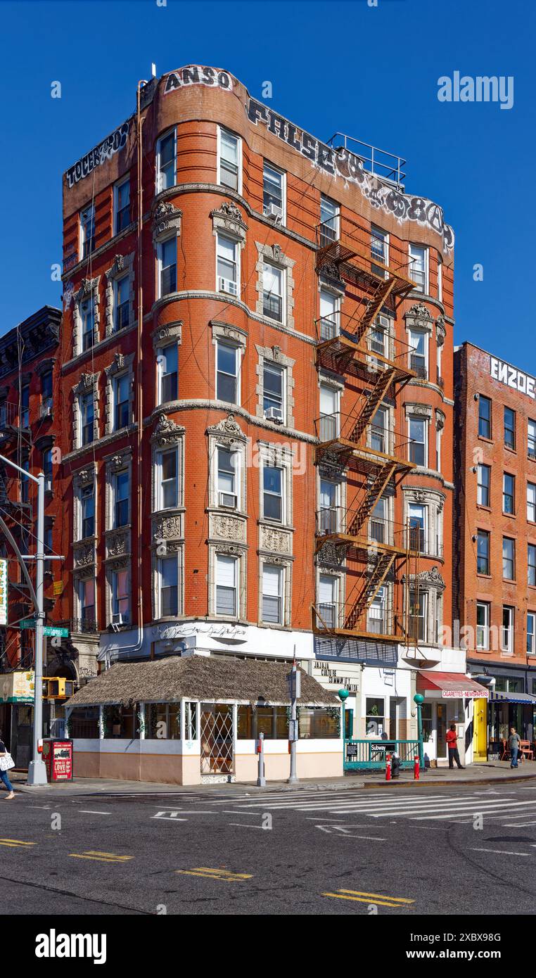 Ornate terra cotta spandrels and window surrounds grace this red-brick ...