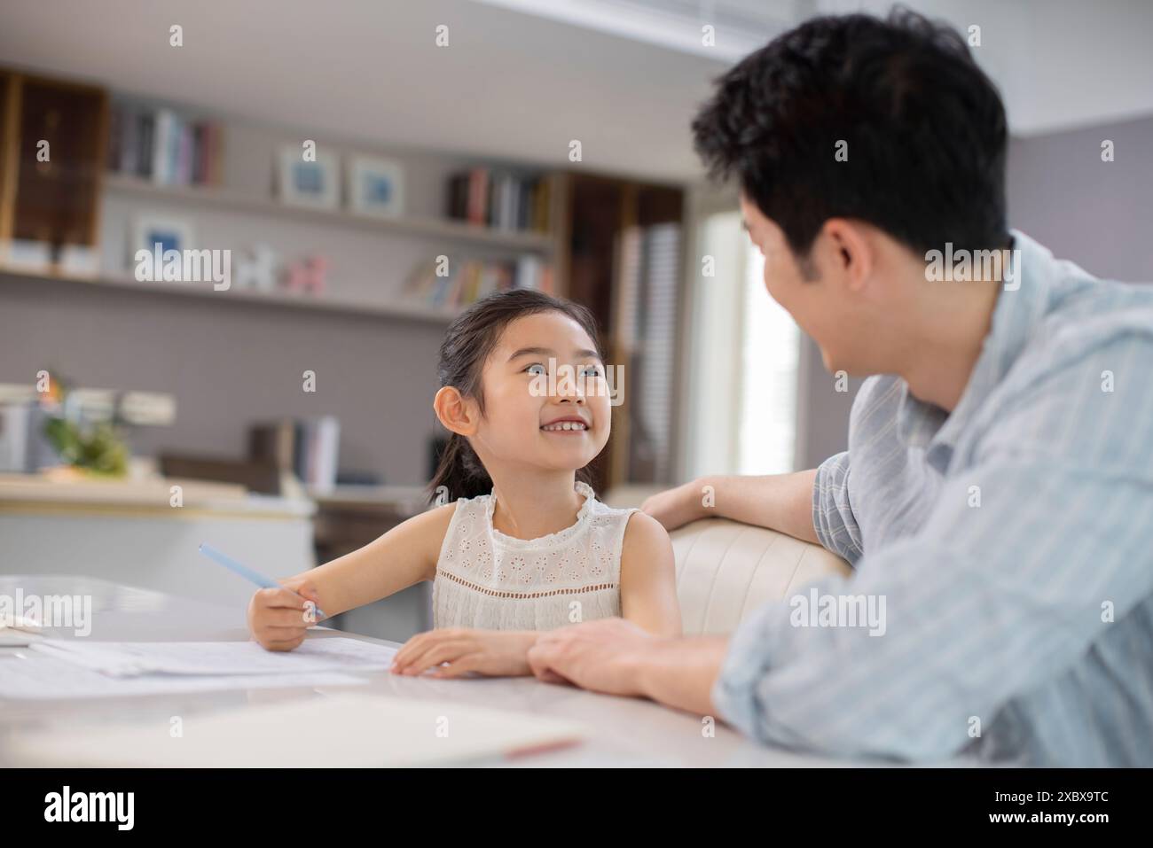 Dad Helping Daughter With Her Homework Stock Photo - Alamy