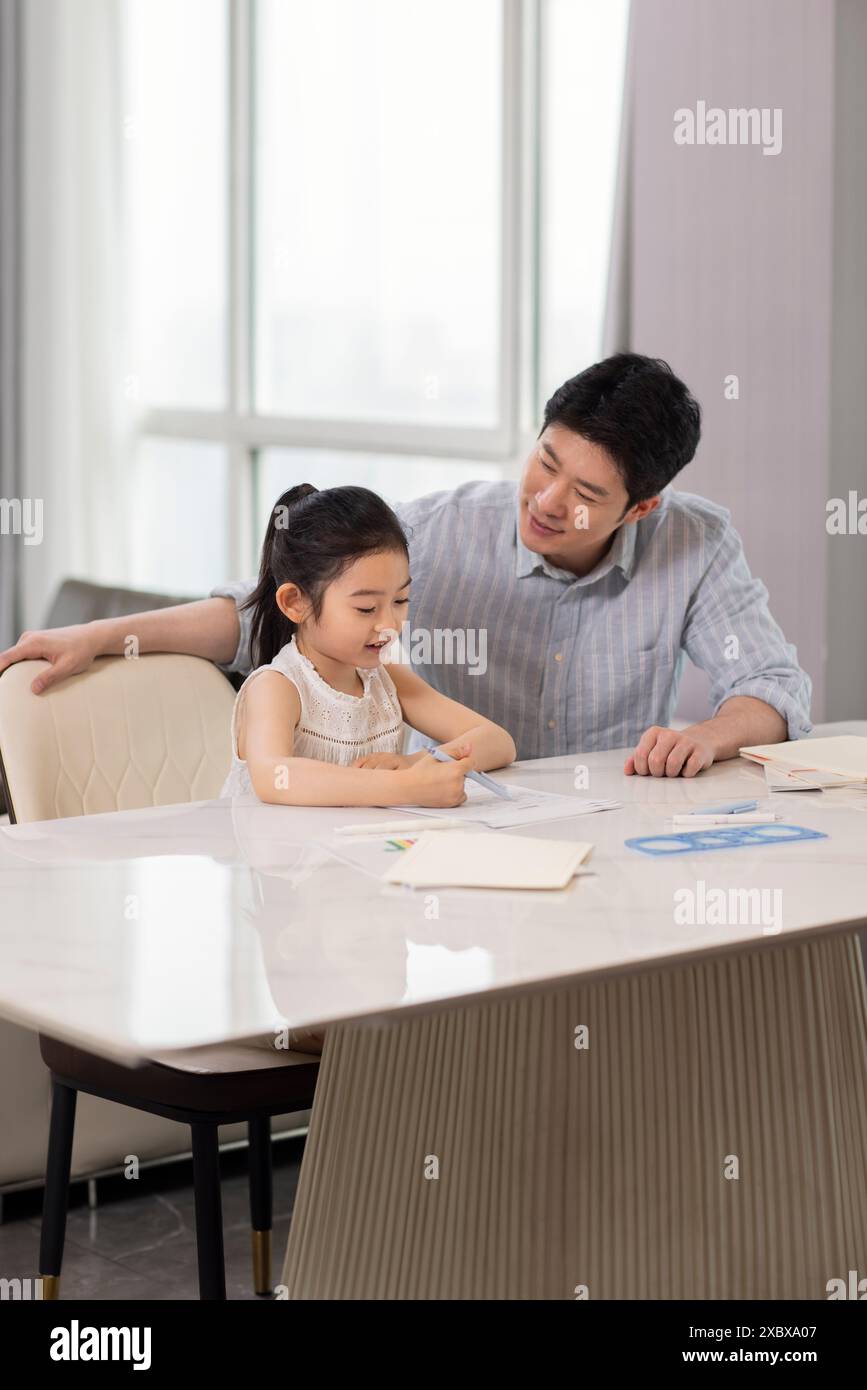Asian father helping daughter homework hi-res stock photography and ...